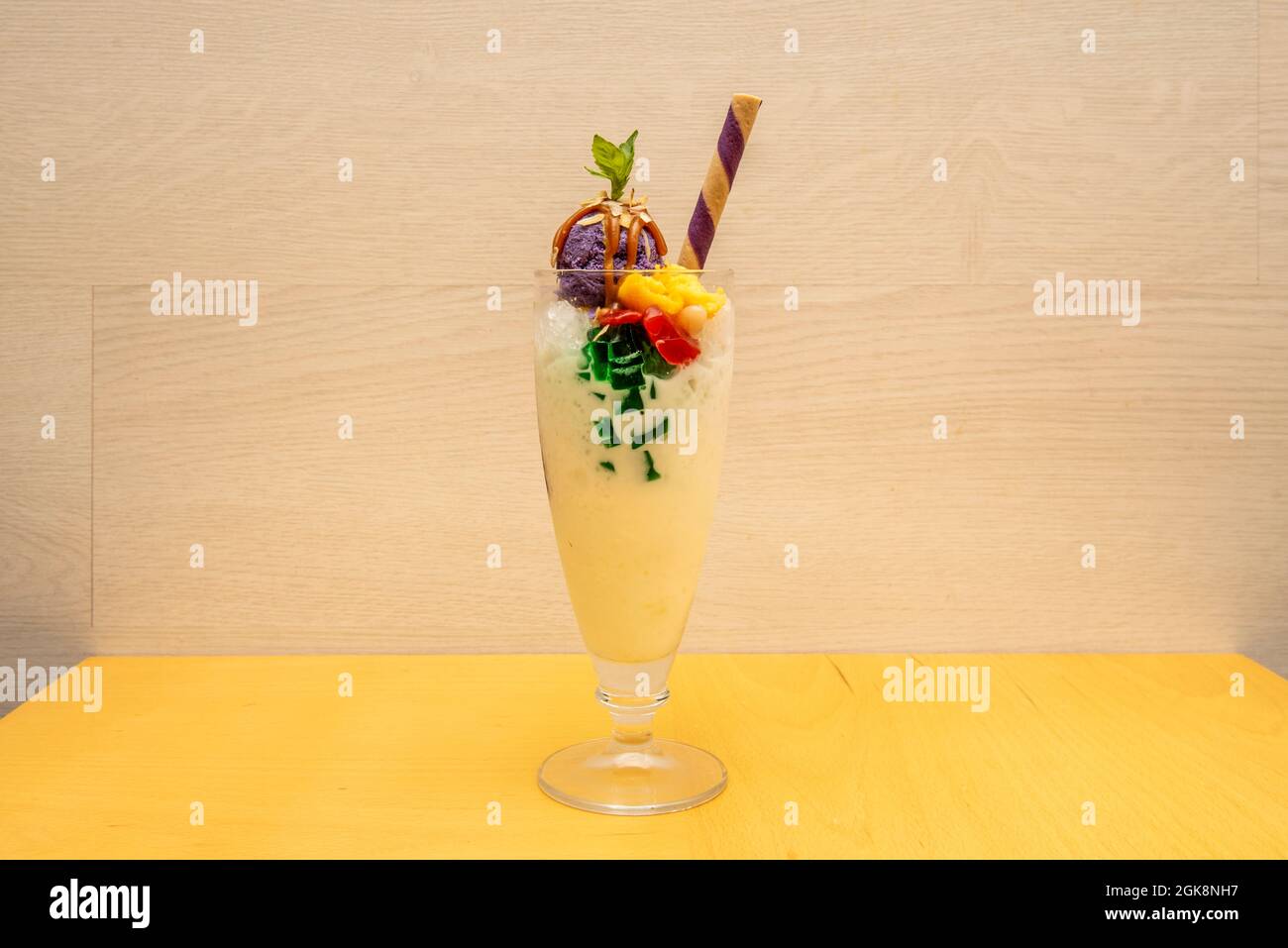 Long glass goblet with Filipino halo halo juice with wafer and ice ...