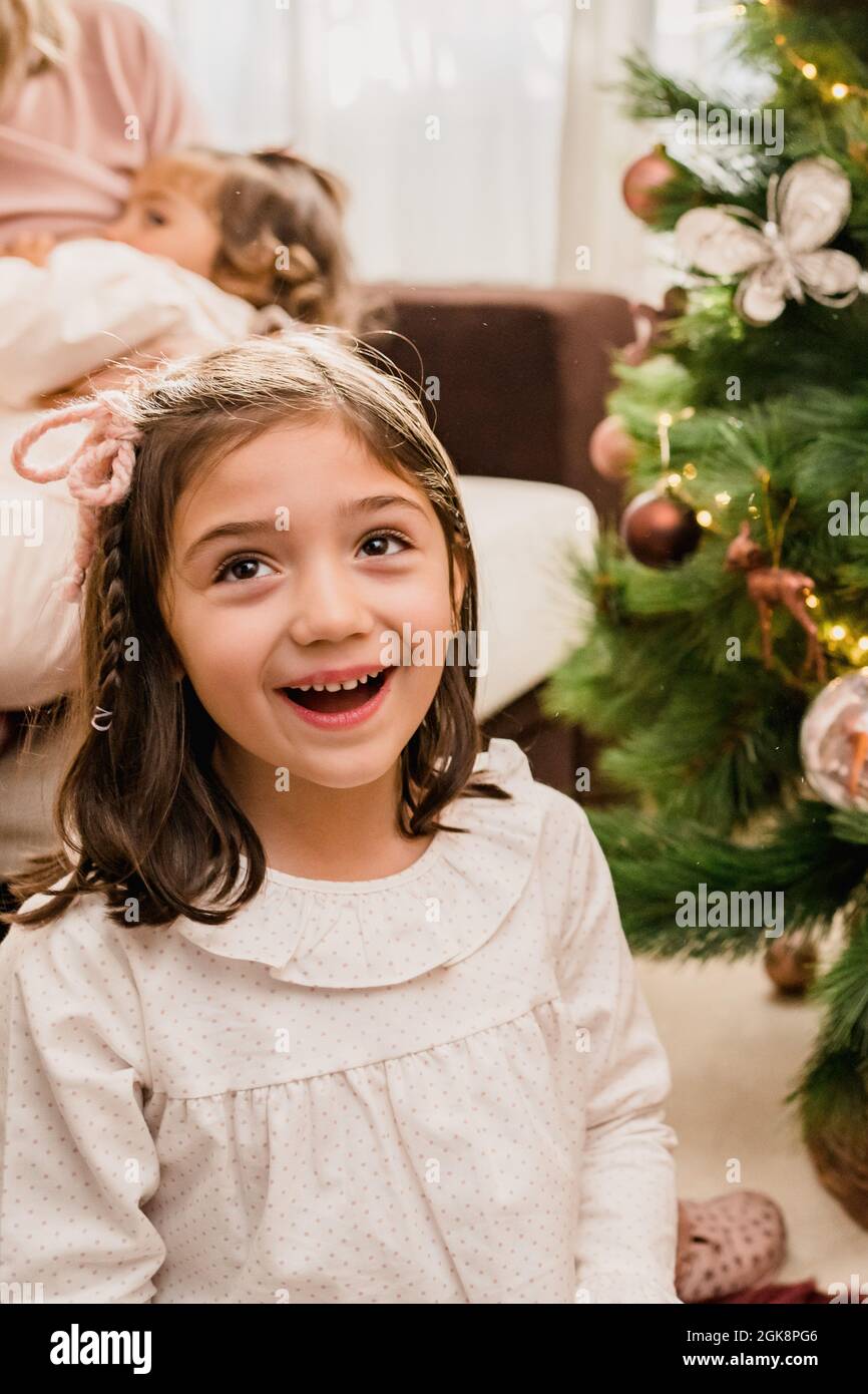 Pondering child looking up against crop anonymous mom breastfeeding ...