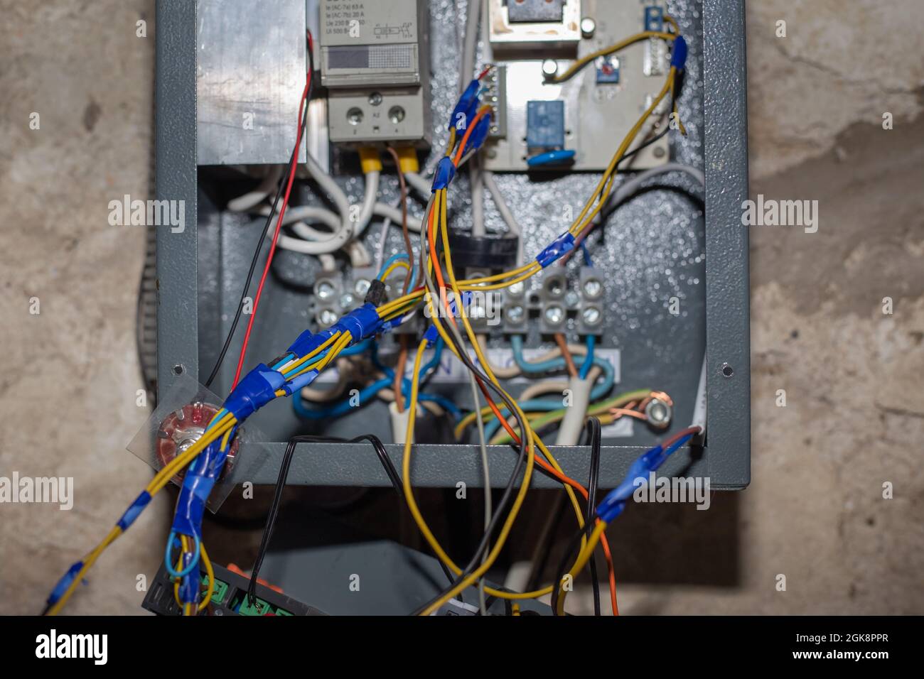 Installation of wire contacts in an electric boiler for heating a house ...