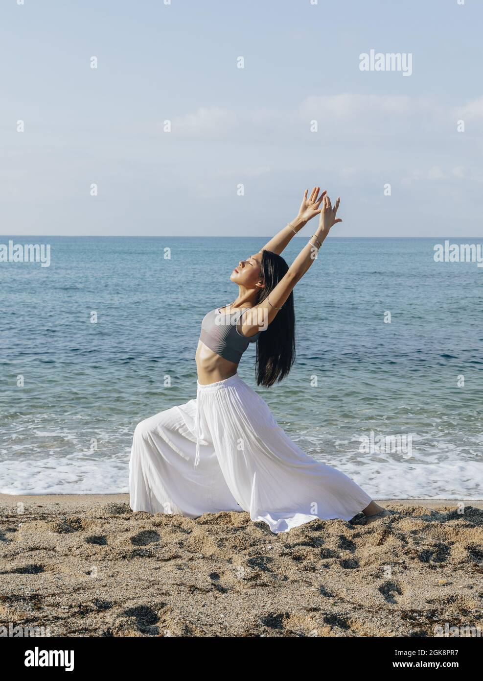 Side view of ethnic female leaning back while standing in Ashta ...