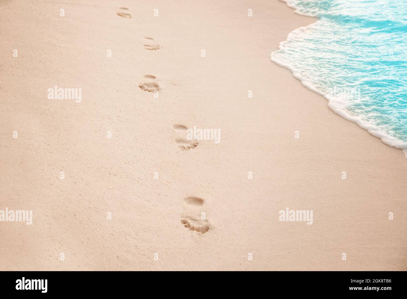Human footprints on beach sand at resort Stock Photo - Alamy