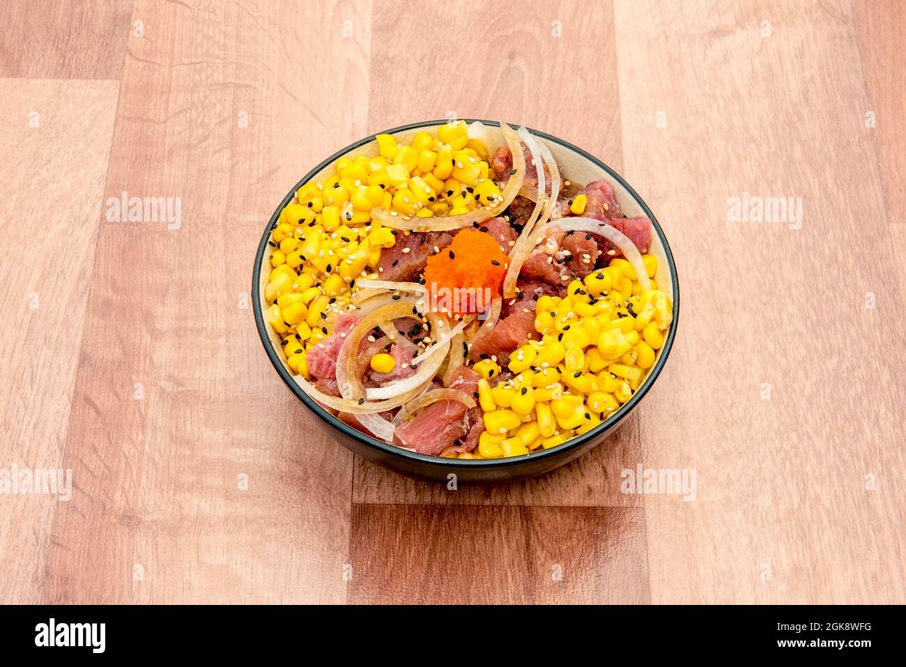 bowl of red tuna with lots of sweet corn, onion, fish roe and sesame ...