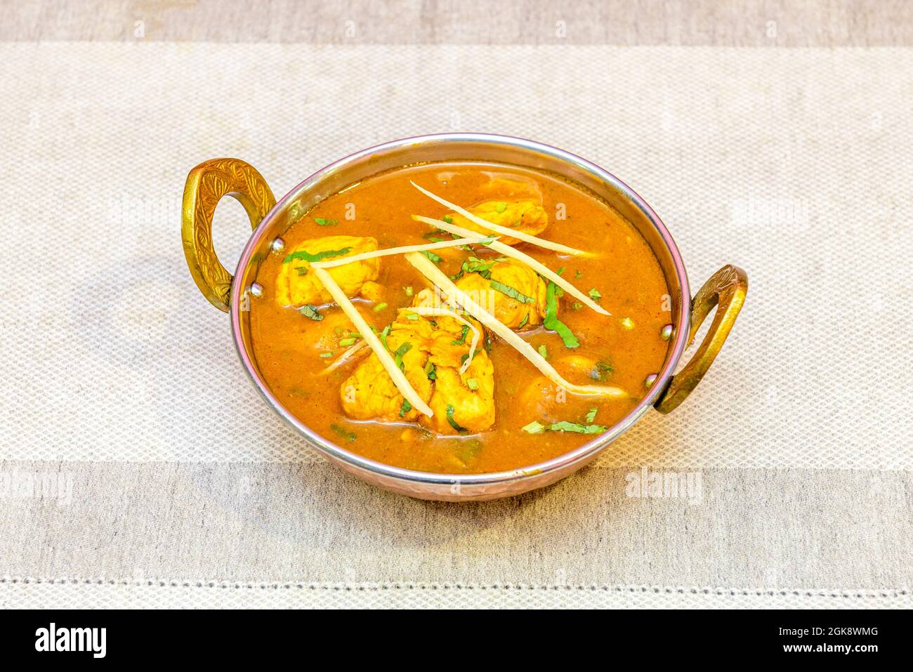 Pakistani chicken curry stew inside a traditional middle eastern metal ...