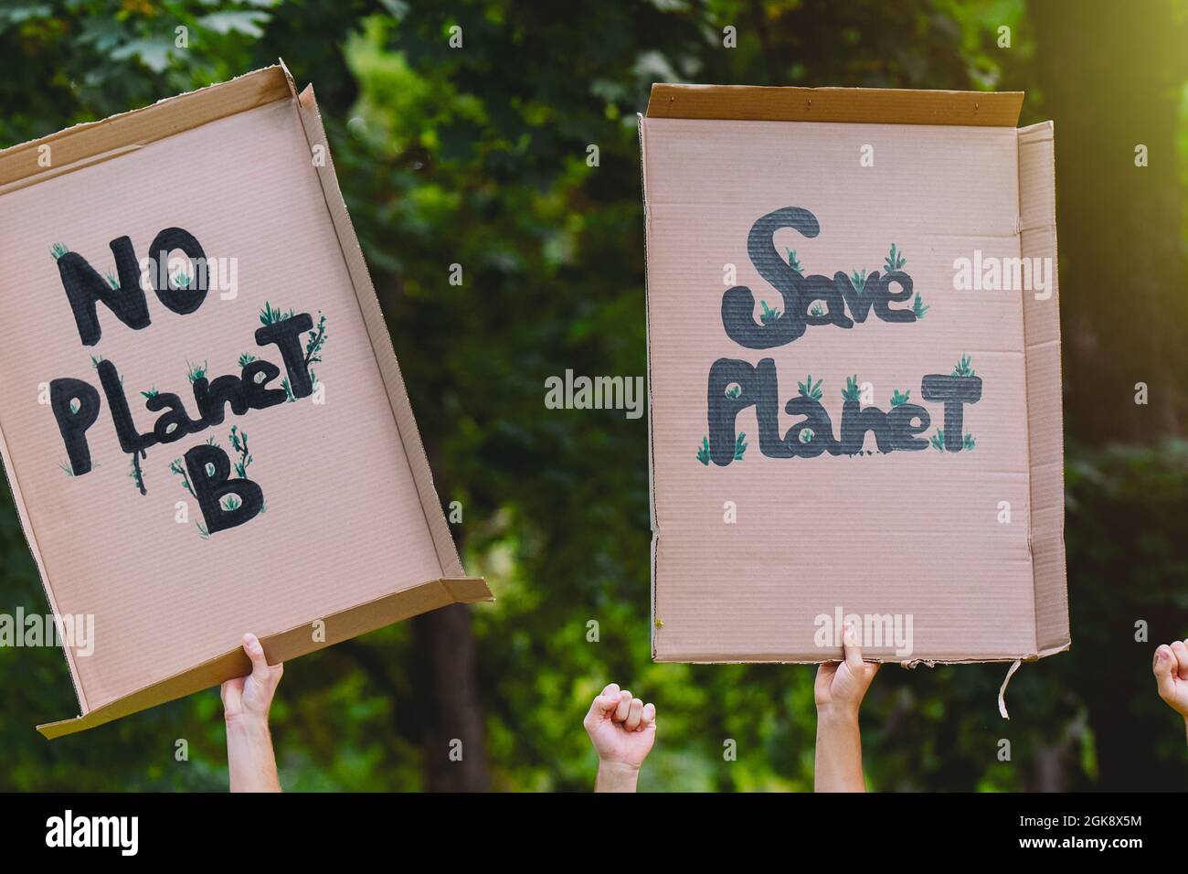 Group of activists with banners protesting over pollution and global ...