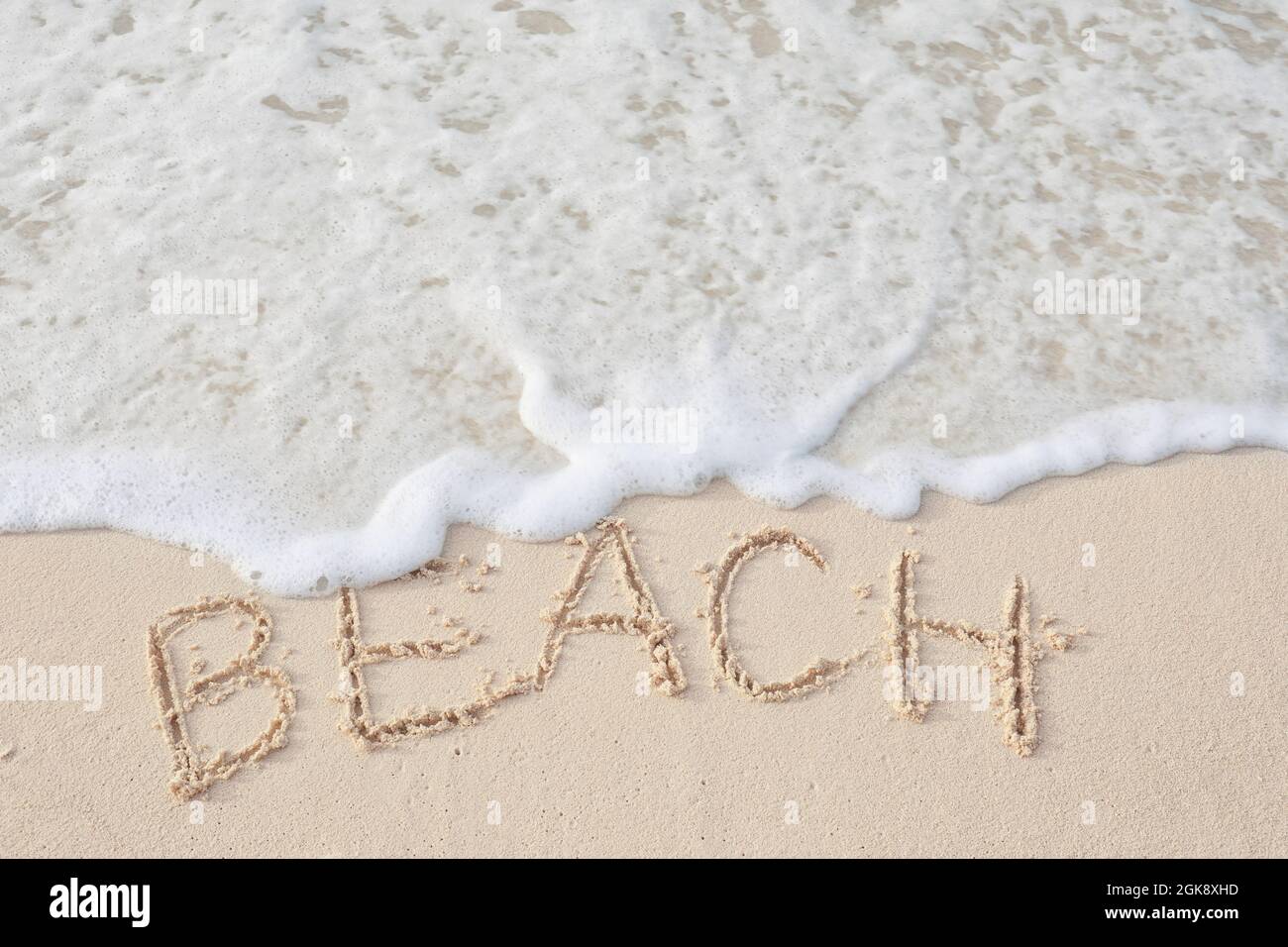 Word BEACH on sand at sea resort. Summer vacation concept Stock Photo ...