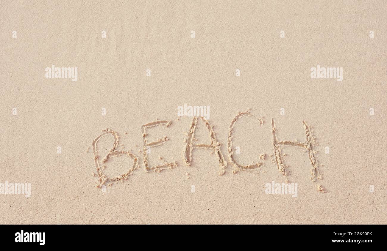 Word BEACH on sand at sea resort. Summer vacation concept Stock Photo ...
