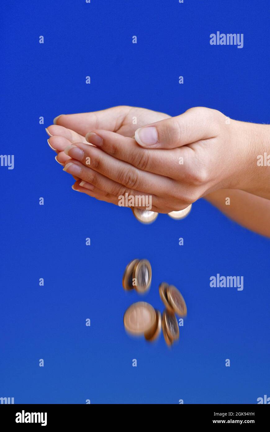 Money falling hands hi-res stock photography and images - Alamy