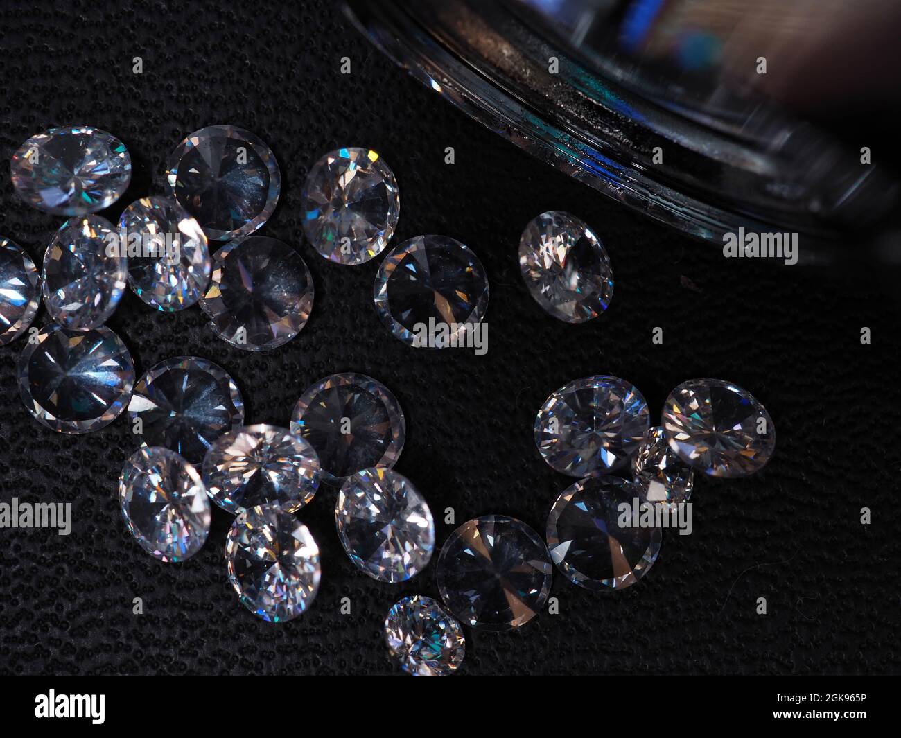 Close up shoot of shiny diamonds. Shoot on a black textured background ...