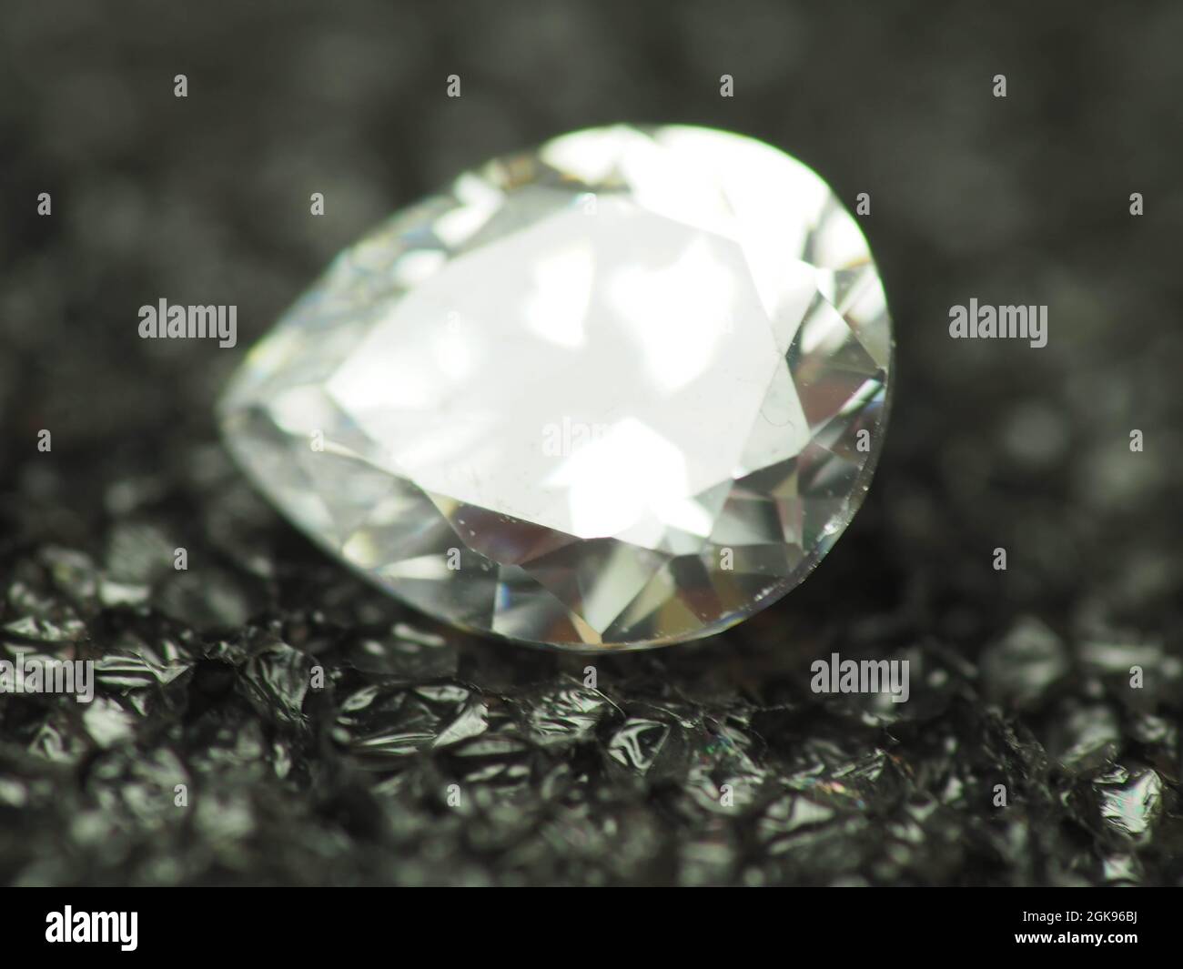 Close up shoot of pear shape diamond. Capture on black background Stock ...