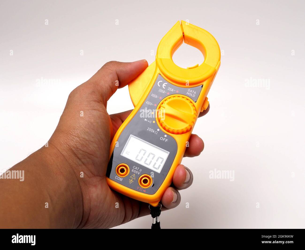 Picture of yellow digital clamp meter that using for measuring ...