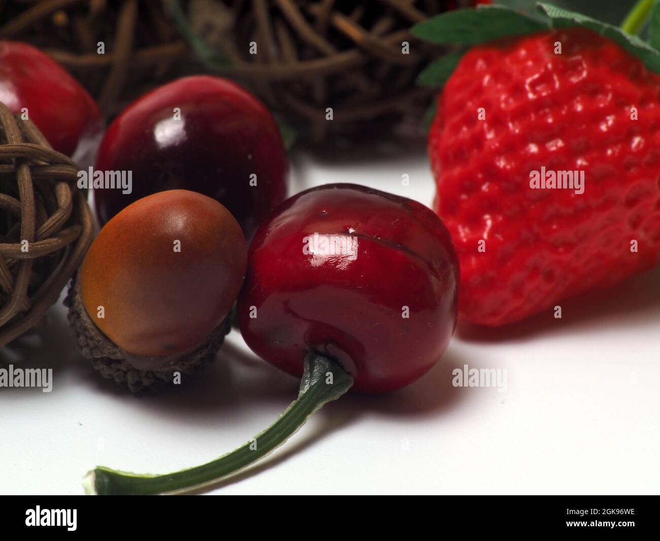 close up shoot of fruits and rattan balls. Shoot on a white isolated ...