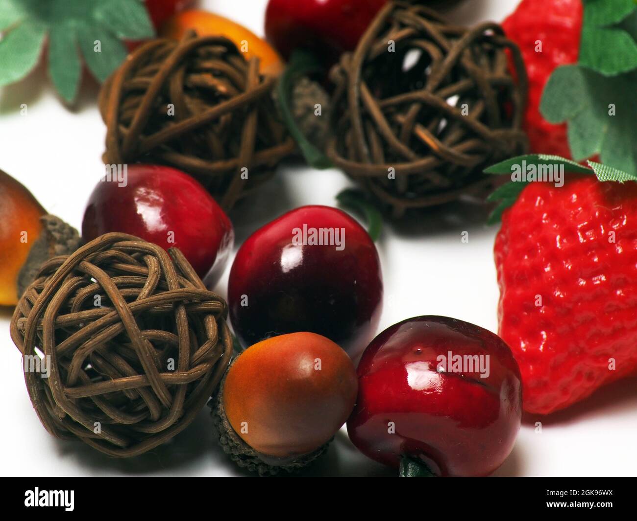 close up shoot of fruits and rattan balls. Shoot on a white isolated ...