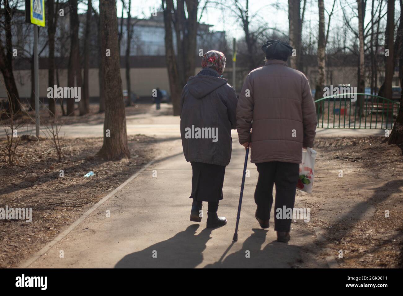 Two pensioners are walking down the street. Grandmothers photographed ...