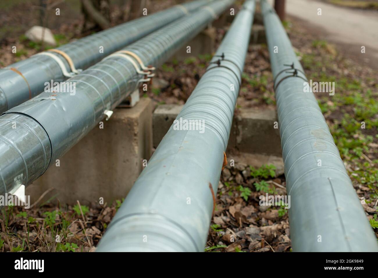 Heating pipes in the city. Stainless steel on city communications. Gas ...