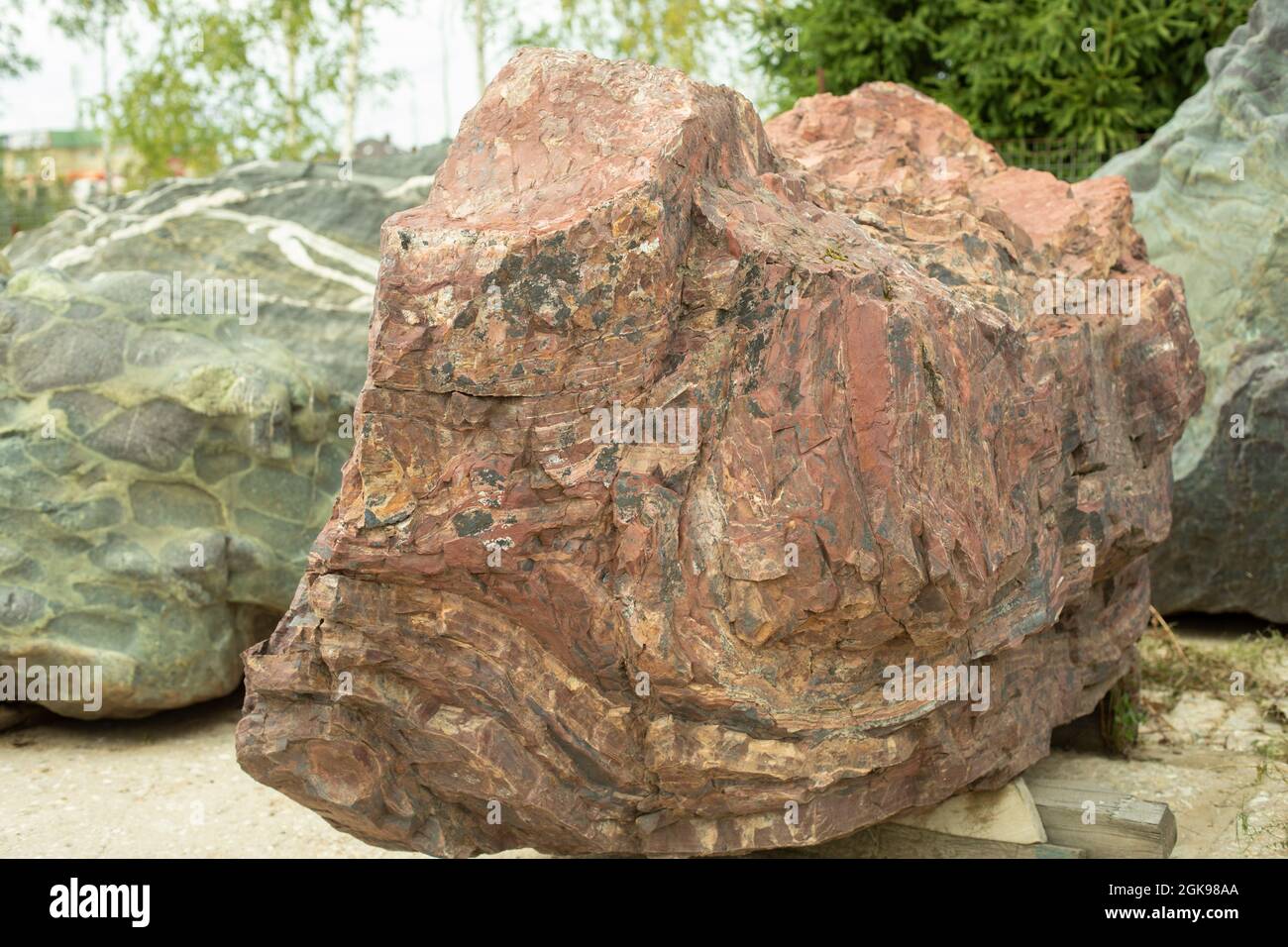 Red stone. Big cobblestone. A piece of rock to install in the garden ...