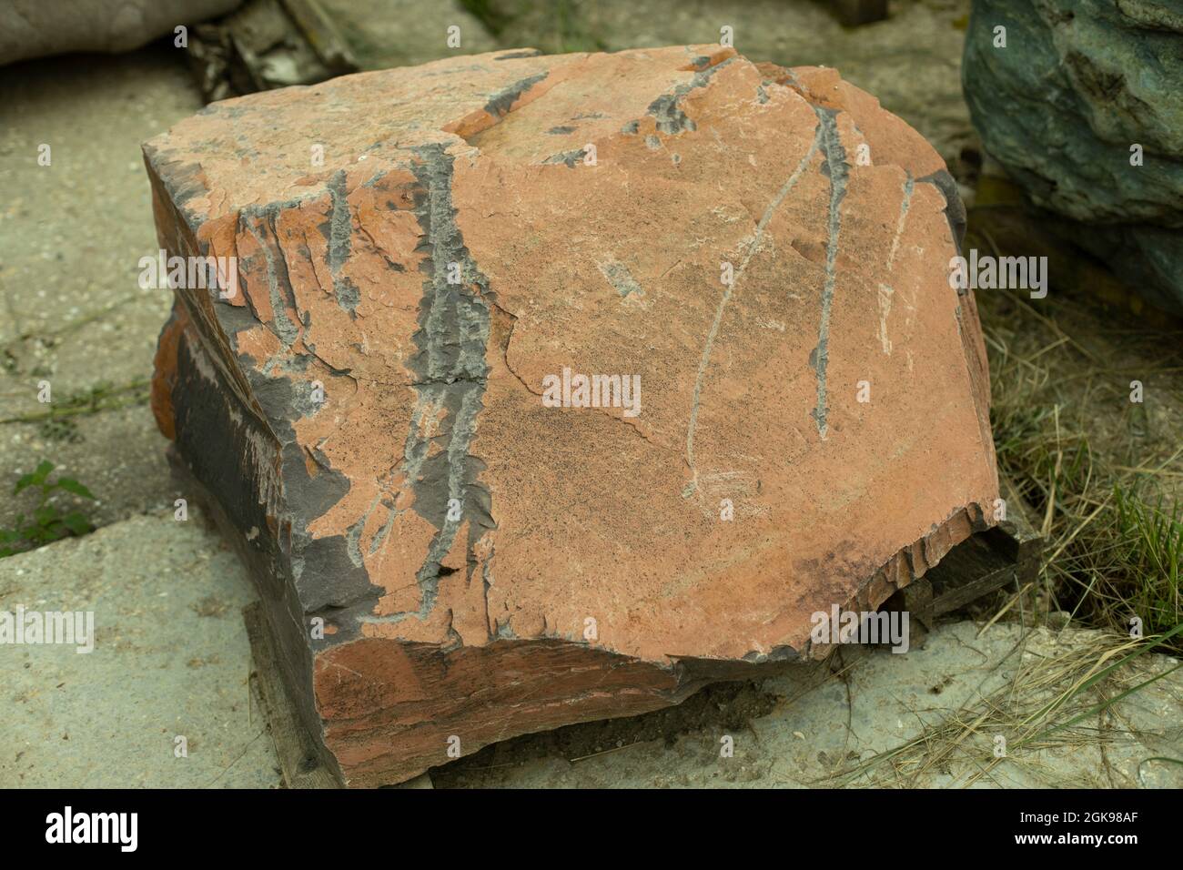 Red stone. Big cobblestone. A piece of rock to install in the garden ...