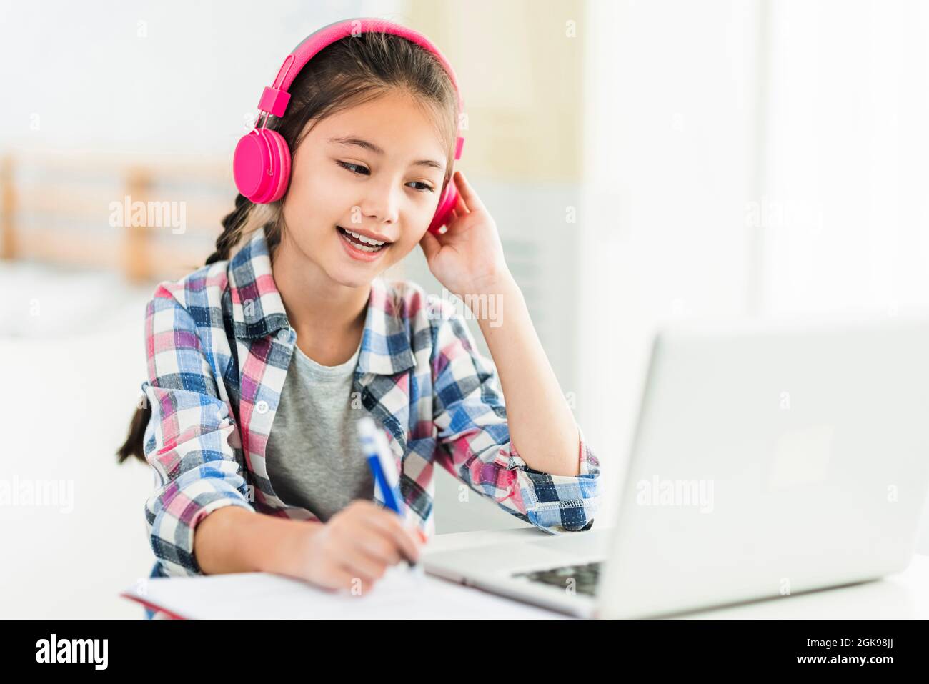 Happy student girl in headphones.Study online on laptop listening ...