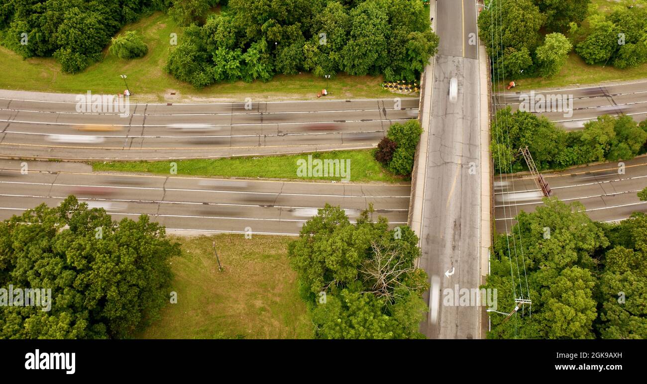 Aerial landscape long exposure shots over a highway on a cloudy day ...