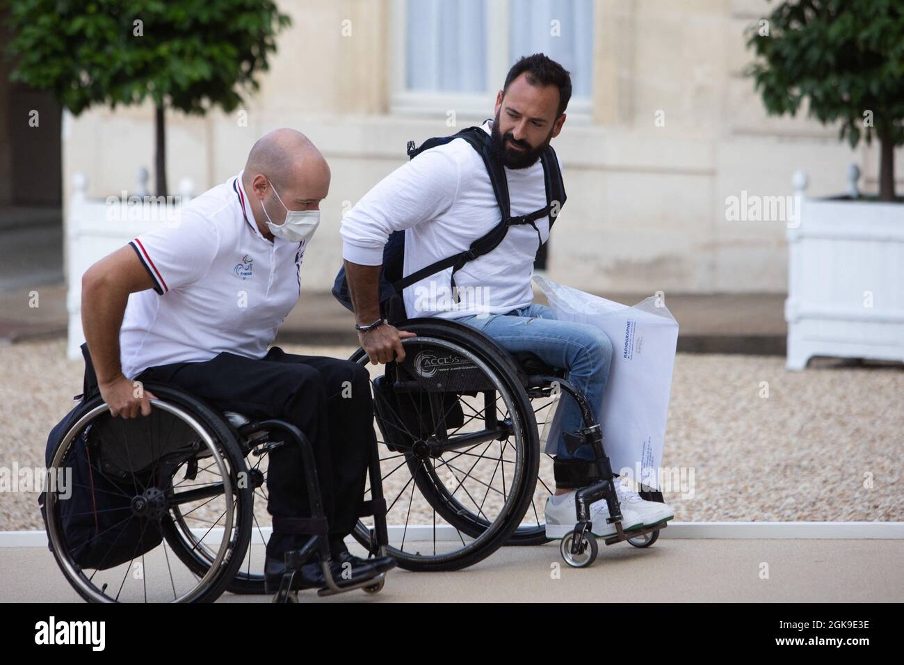 French athlete Michael Jeremiasz arrives prior to the ceremony in honor ...