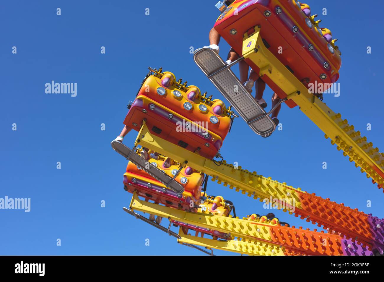 detail of people riding on a carousel in an amusement park Stock Photo ...