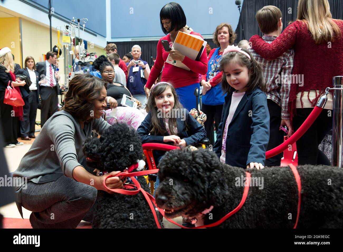 First Lady Michelle Obama, with family pets Bo and Sunny, greets ...