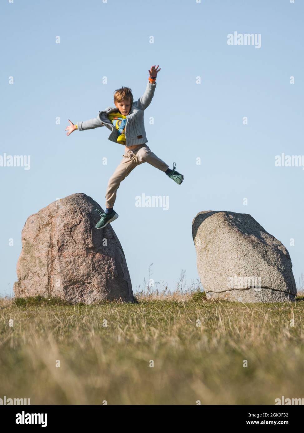 Children jumping off park hi-res stock photography and images - Alamy