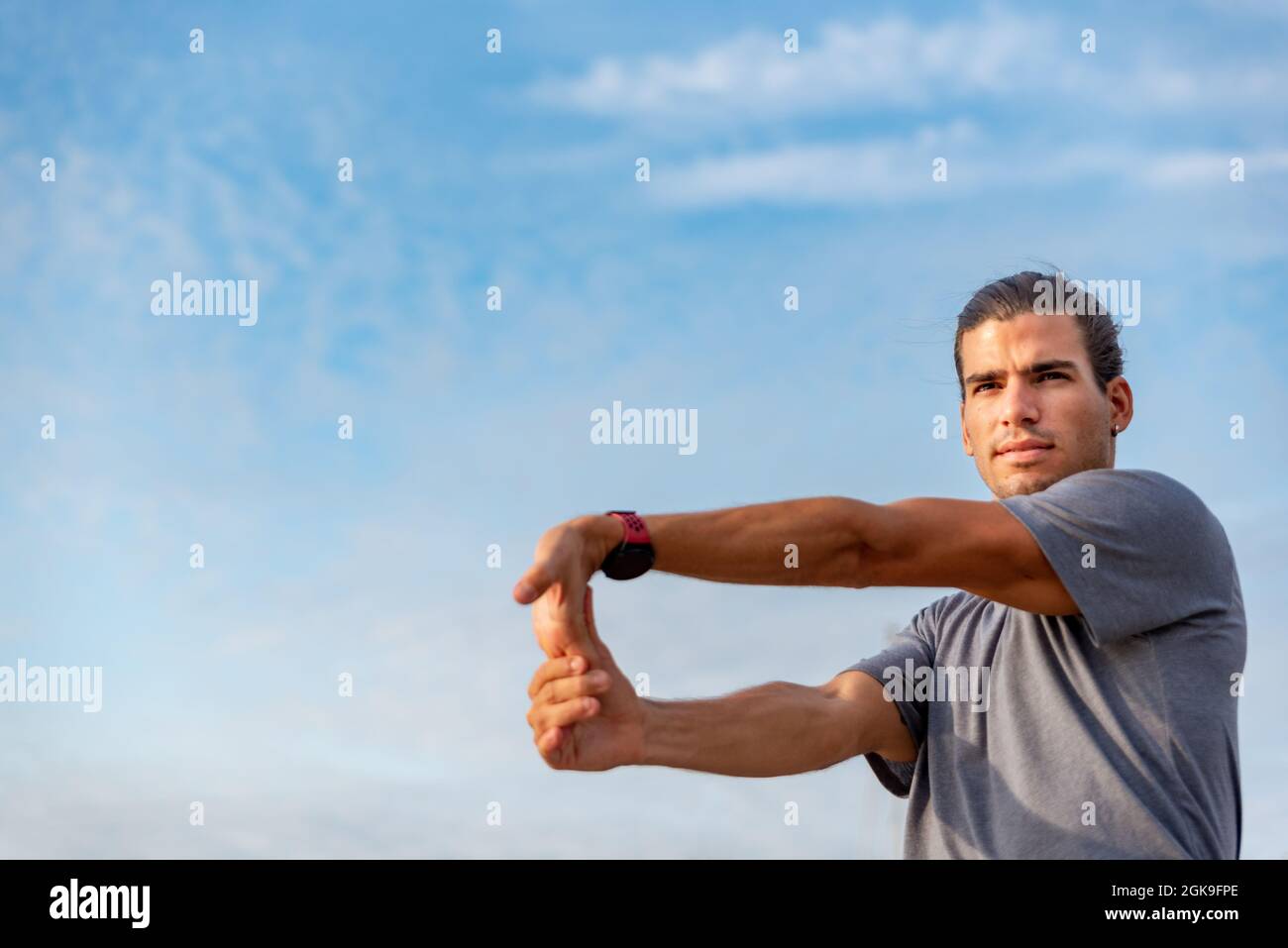 Young guy doing stretching hi-res stock photography and images - Alamy