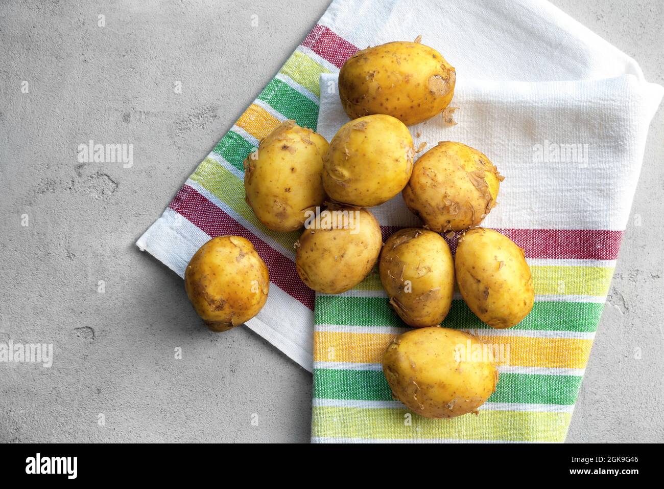 Raw organic potato on grey background Stock Photo - Alamy