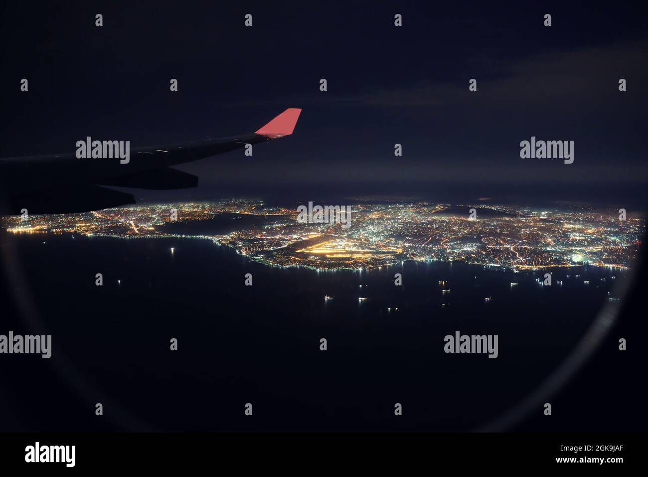 Night view of big city from airplane window Stock Photo - Alamy
