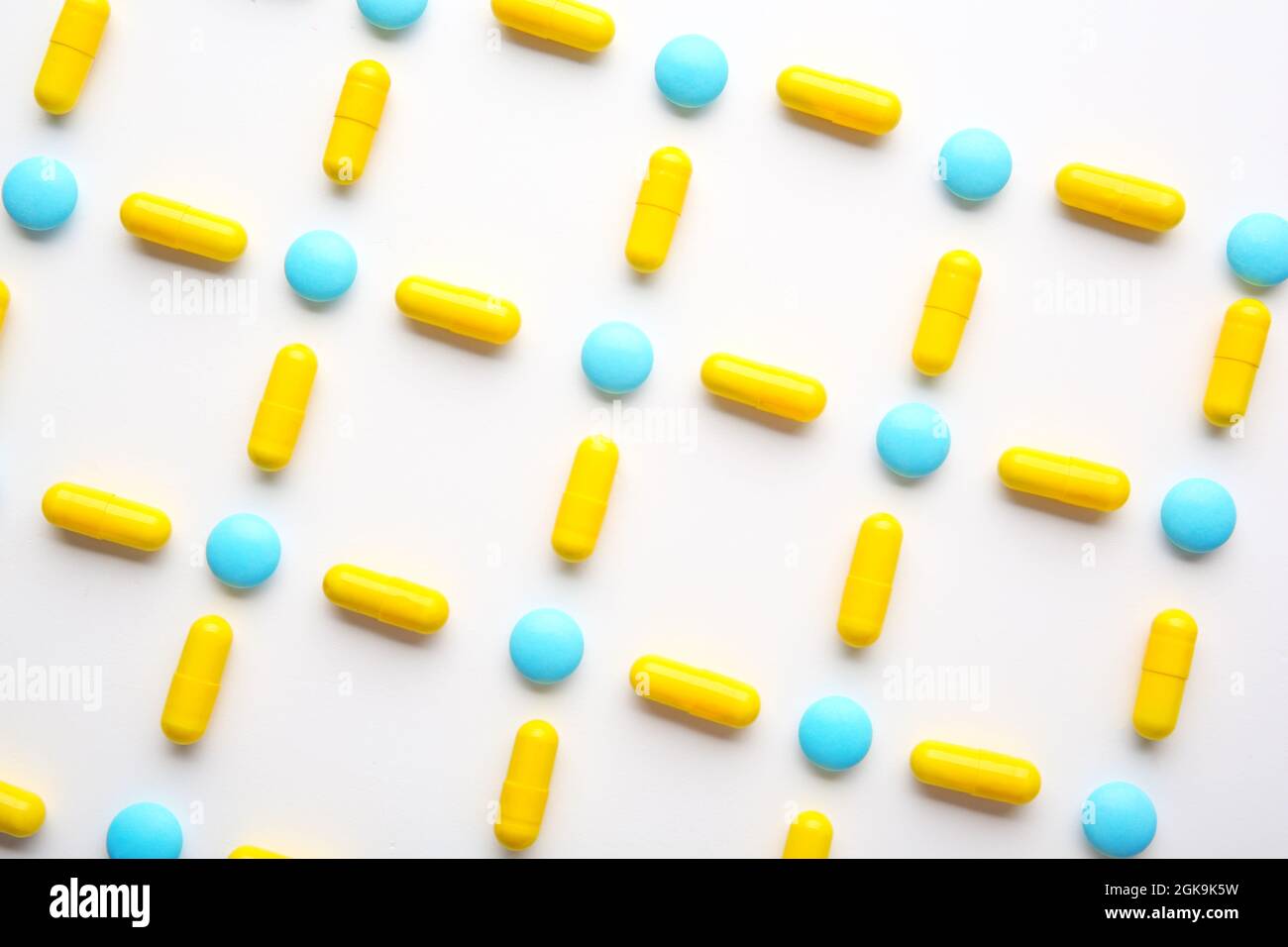Different colorful pills on white background Stock Photo - Alamy