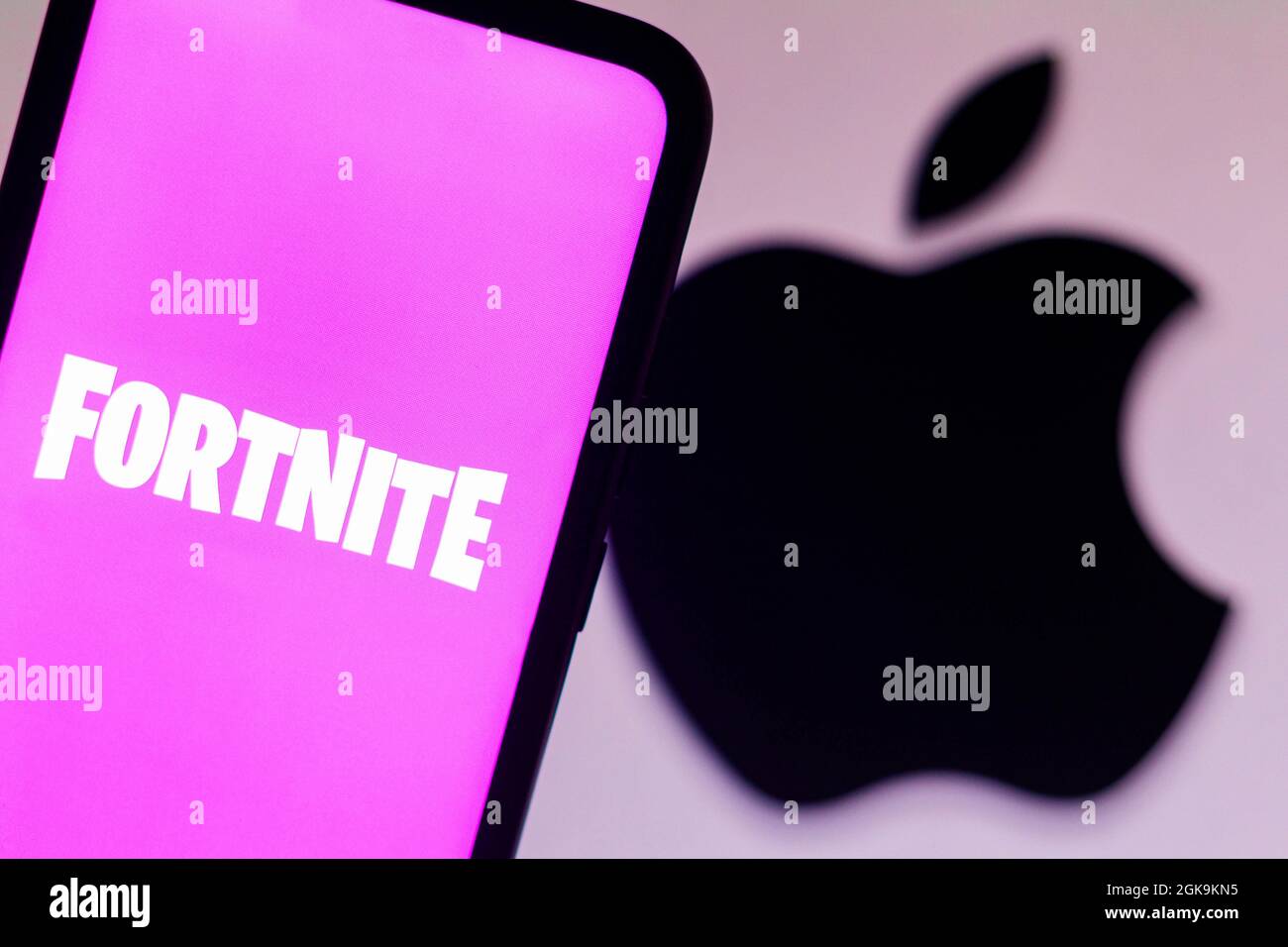 In this photo illustration the Fortnite logo seen displayed on a ...