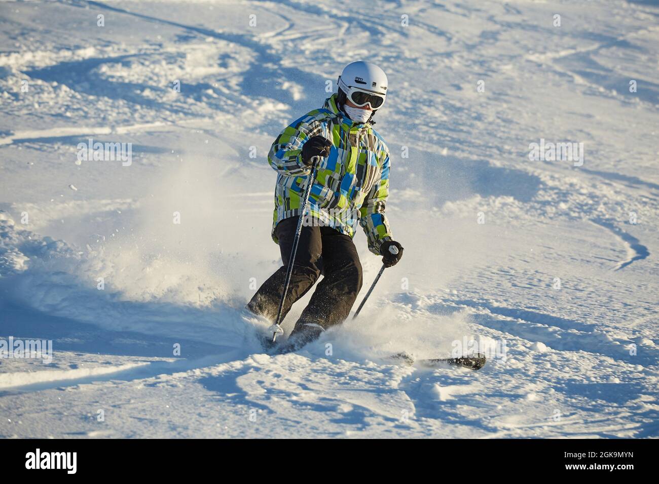 Skier on steep slope hi-res stock photography and images - Alamy