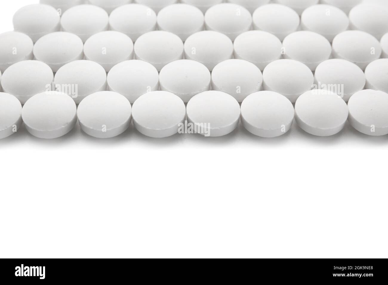 Round pills on white background Stock Photo - Alamy