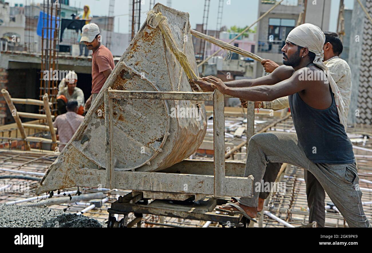 Construction workers working at a development Stock Photo - Alamy