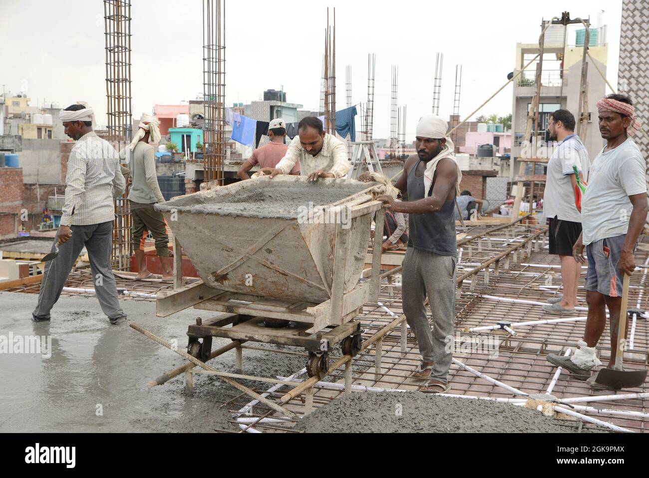 Construction workers working at a development Stock Photo - Alamy