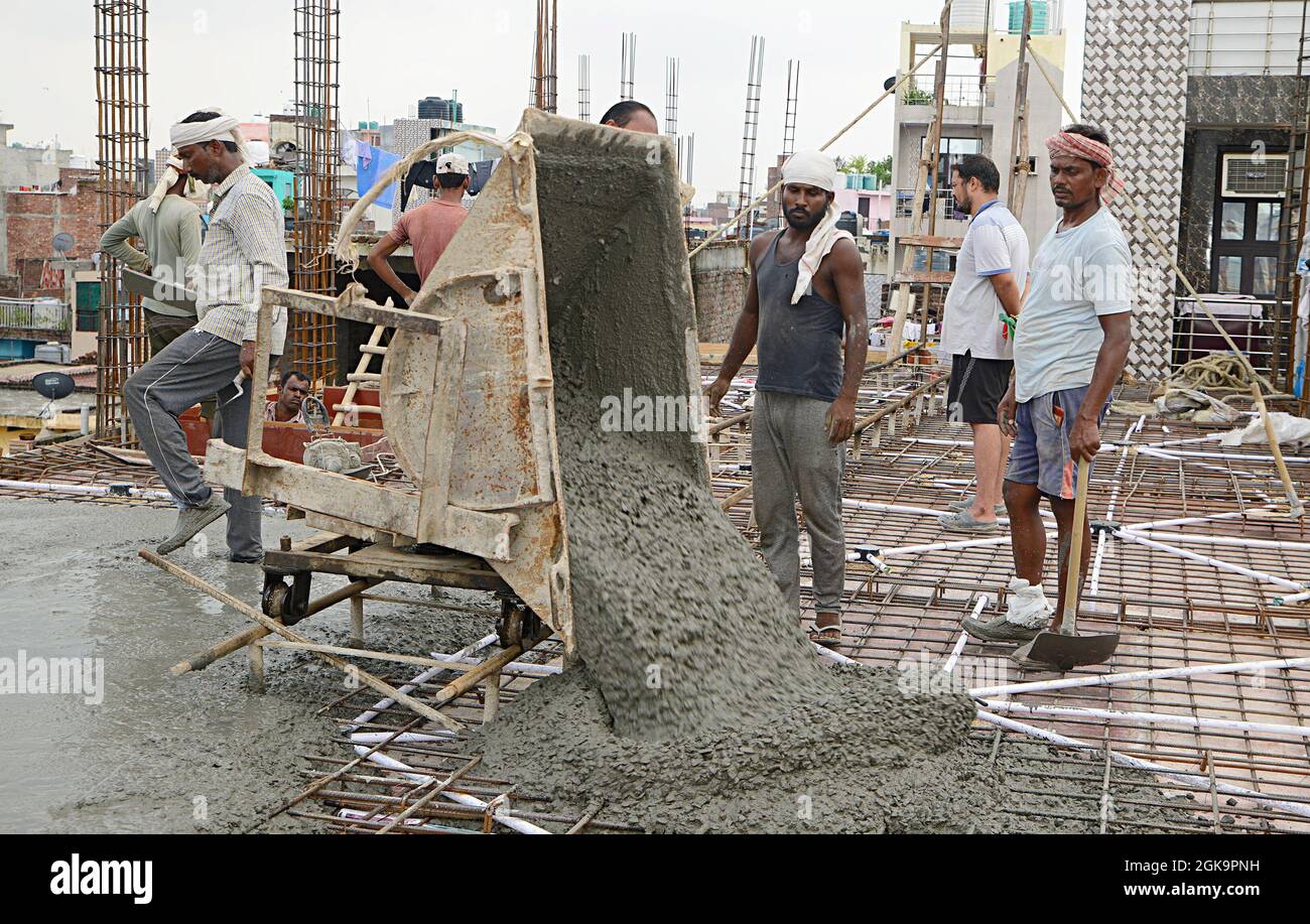 Construction workers working at a development Stock Photo - Alamy