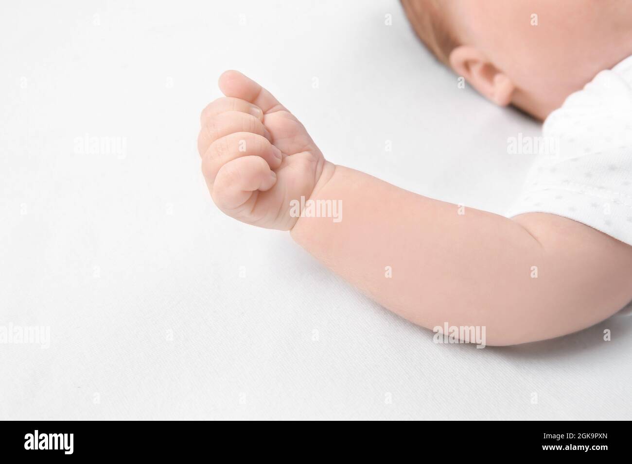 Arm of cute newborn baby on white background Stock Photo - Alamy