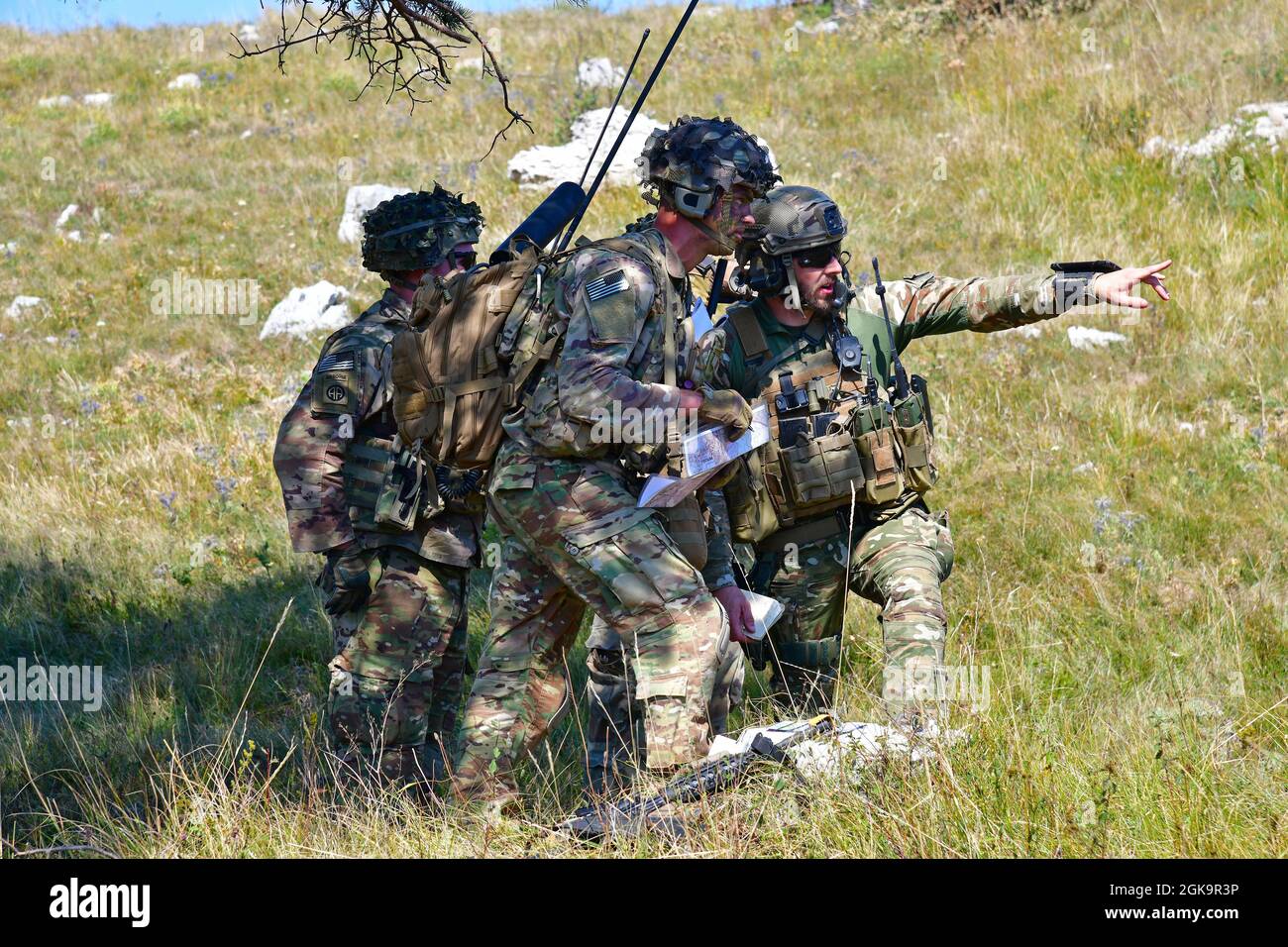 A Slovenian Soldier speaks with U.S. Army Paratroopers assigned to the ...