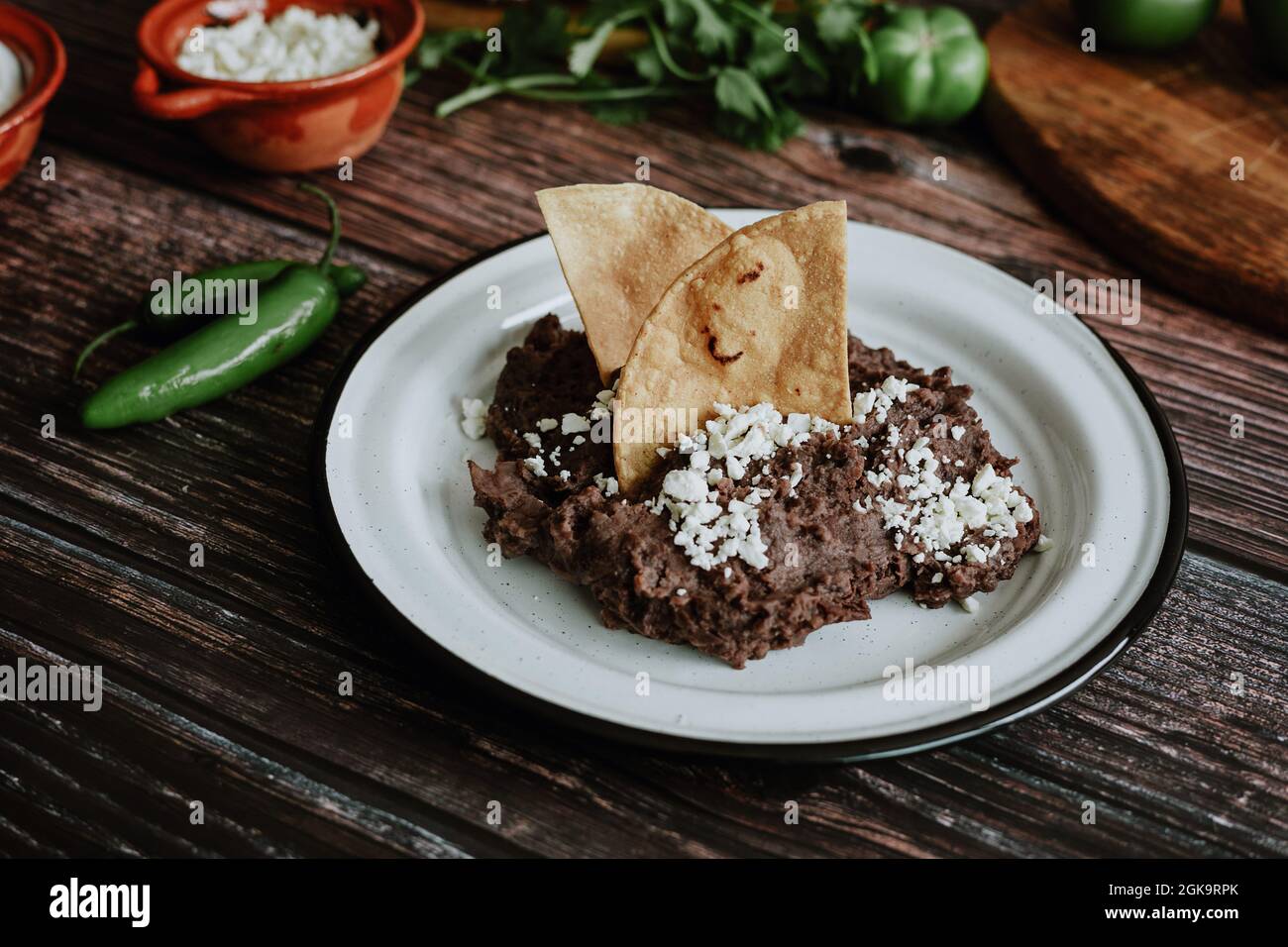 Mexican refried beans with cheese and nachos tortilla corn traditional ...