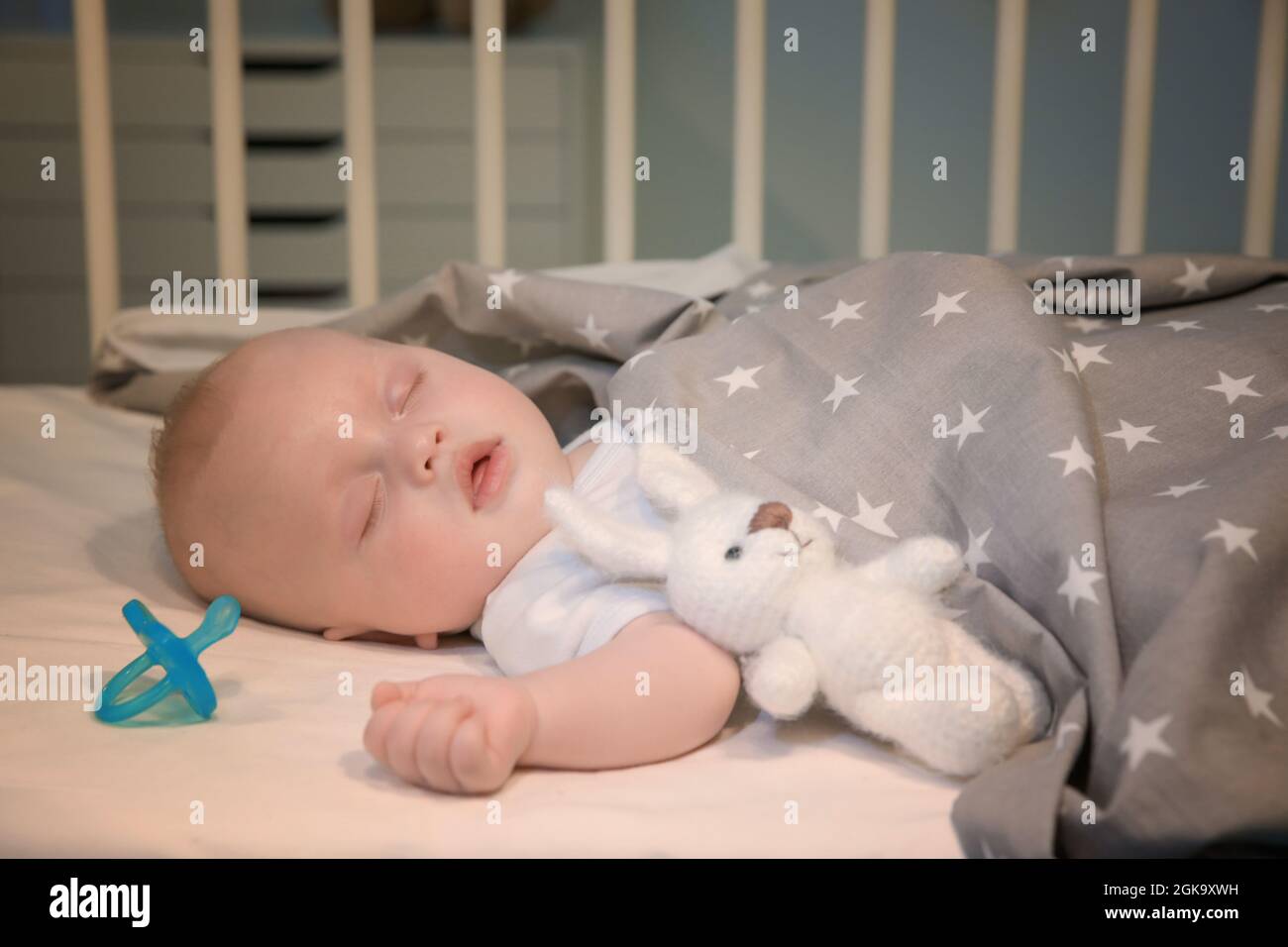 Adorable baby sleeping in cradle at home Stock Photo - Alamy