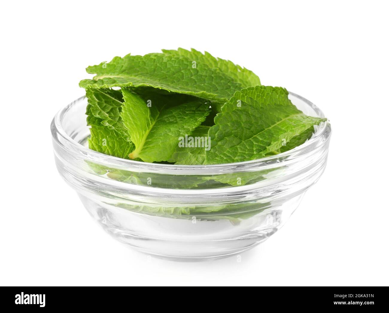 Glass bowl with fresh mint leaves on white background Stock Photo - Alamy
