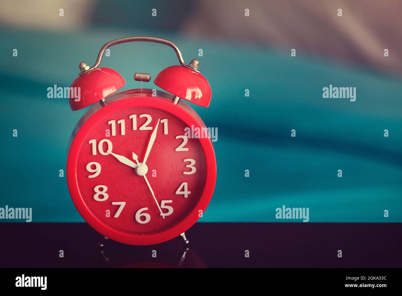 Closeup on clockwise. Face of red Alarm clock at 10 O'clock Stock Photo ...