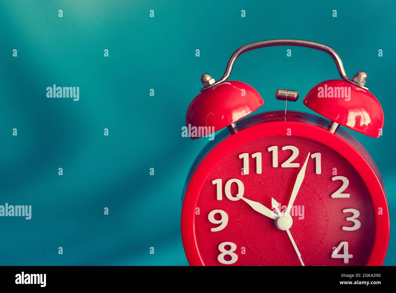 Closeup on clockwise. Face of red Alarm clock at 10 O'clock Stock Photo ...