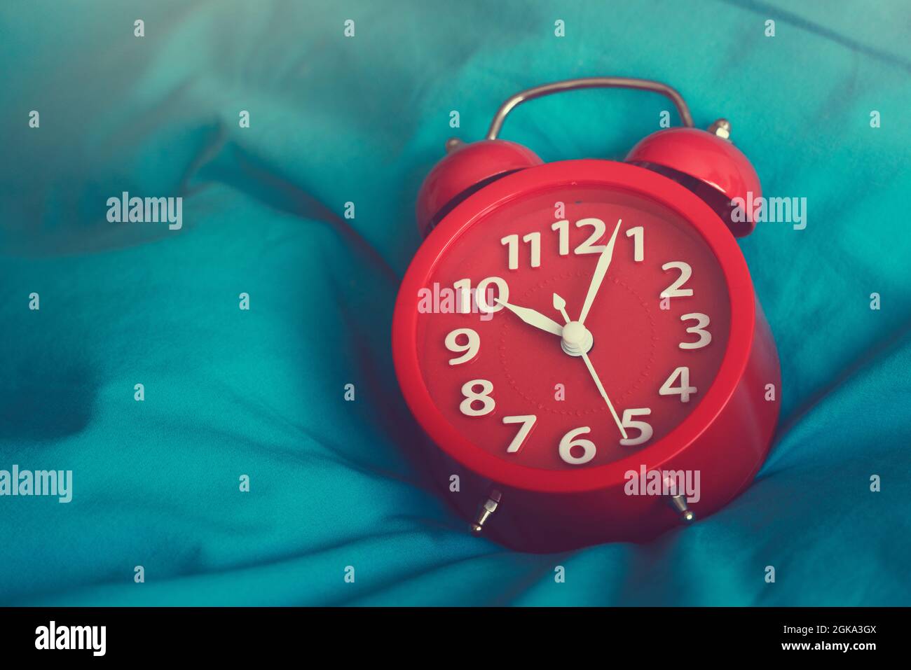 Closeup on clockwise. Face of red Alarm clock at 10 O'clock Stock Photo ...