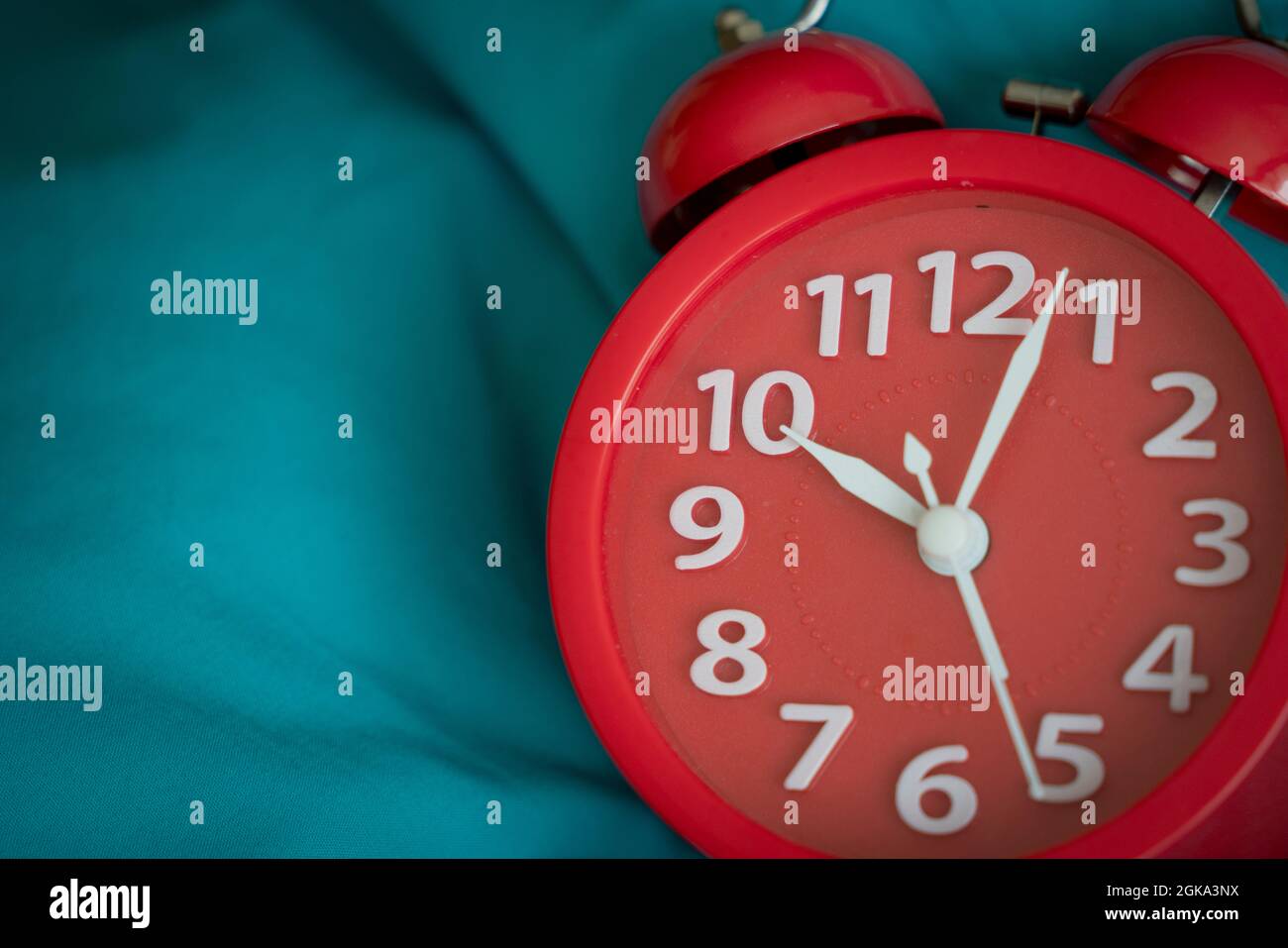 Closeup on clockwise. Face of red Alarm clock at 10 O'clock Stock Photo ...