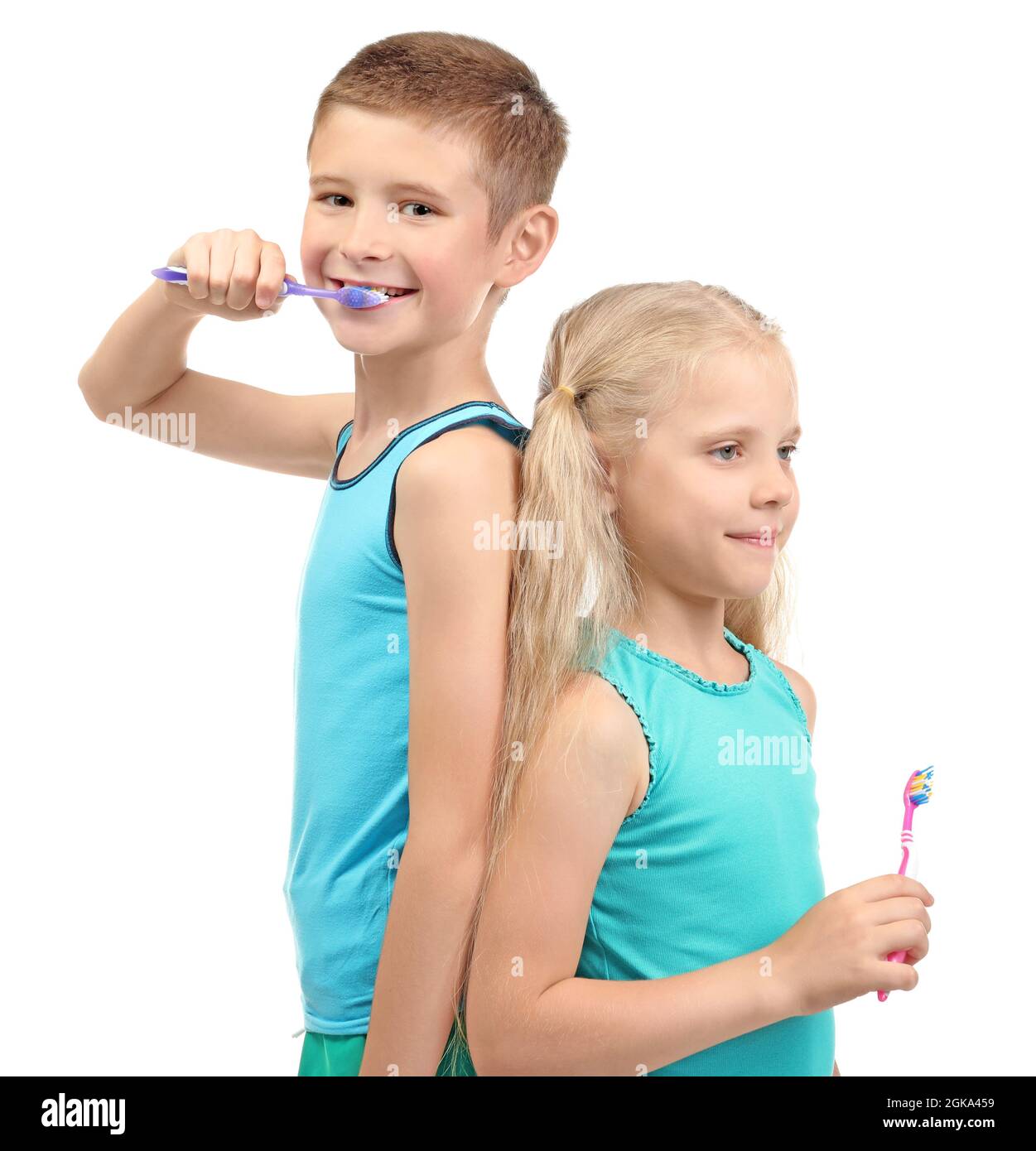 Cute little children cleaning teeth on white background Stock Photo - Alamy
