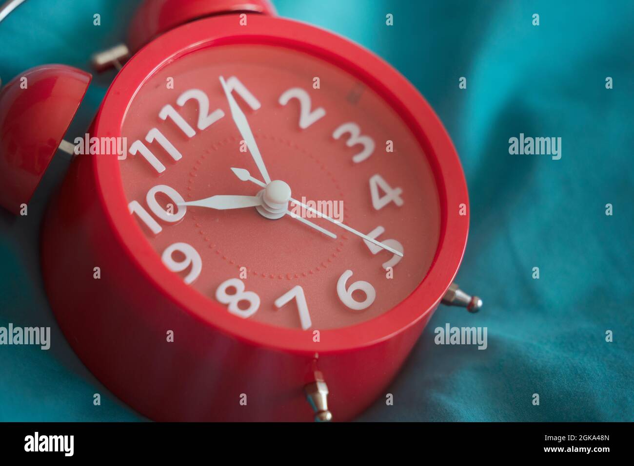 Closeup on clockwise. Face of red Alarm clock at 10 O'clock Stock Photo ...