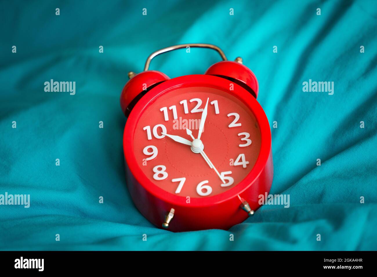 Closeup on clockwise. Face of red Alarm clock at 10 O'clock Stock Photo ...