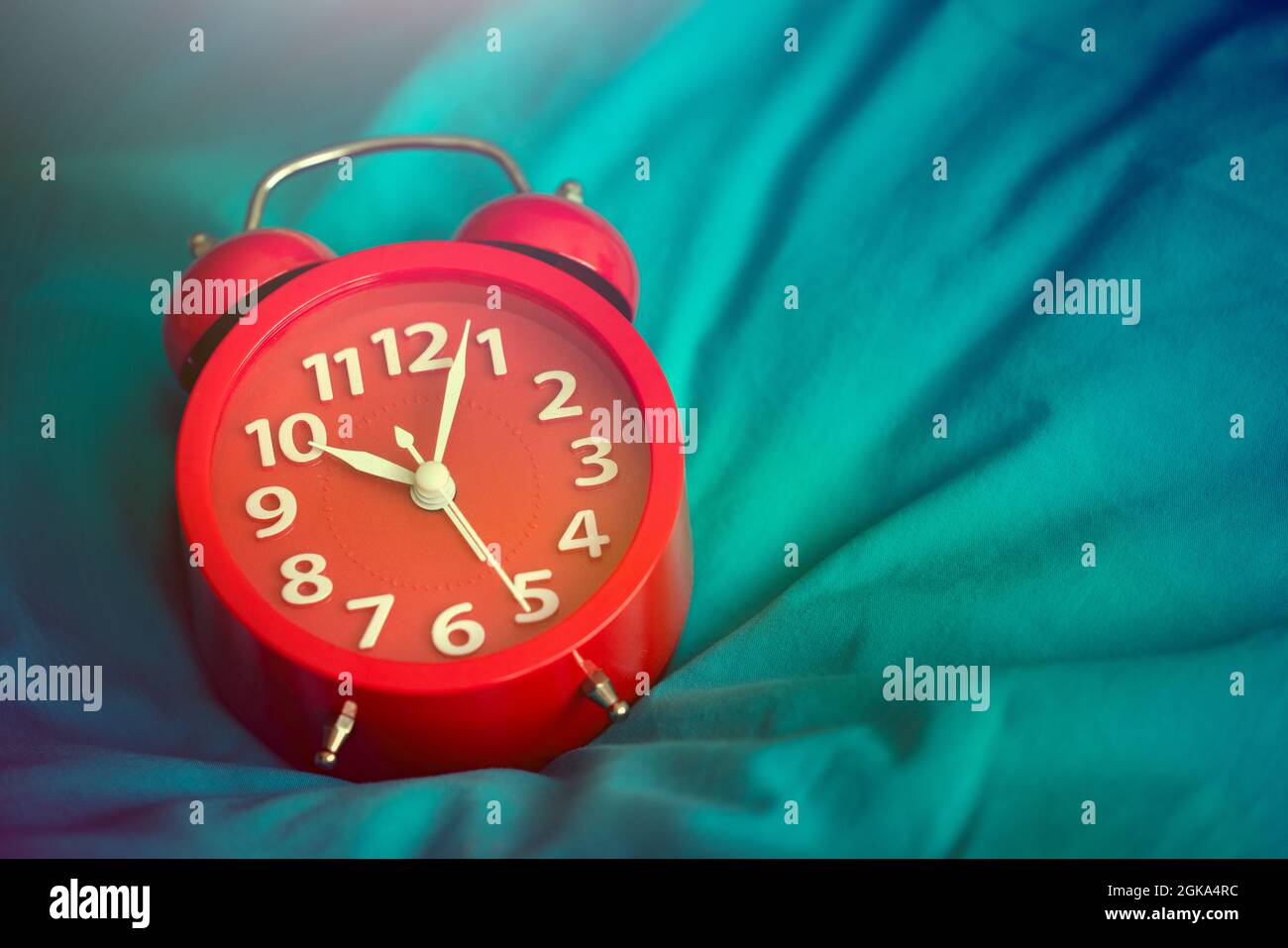 Closeup on clockwise. Face of red Alarm clock at 10 O'clock Stock Photo ...