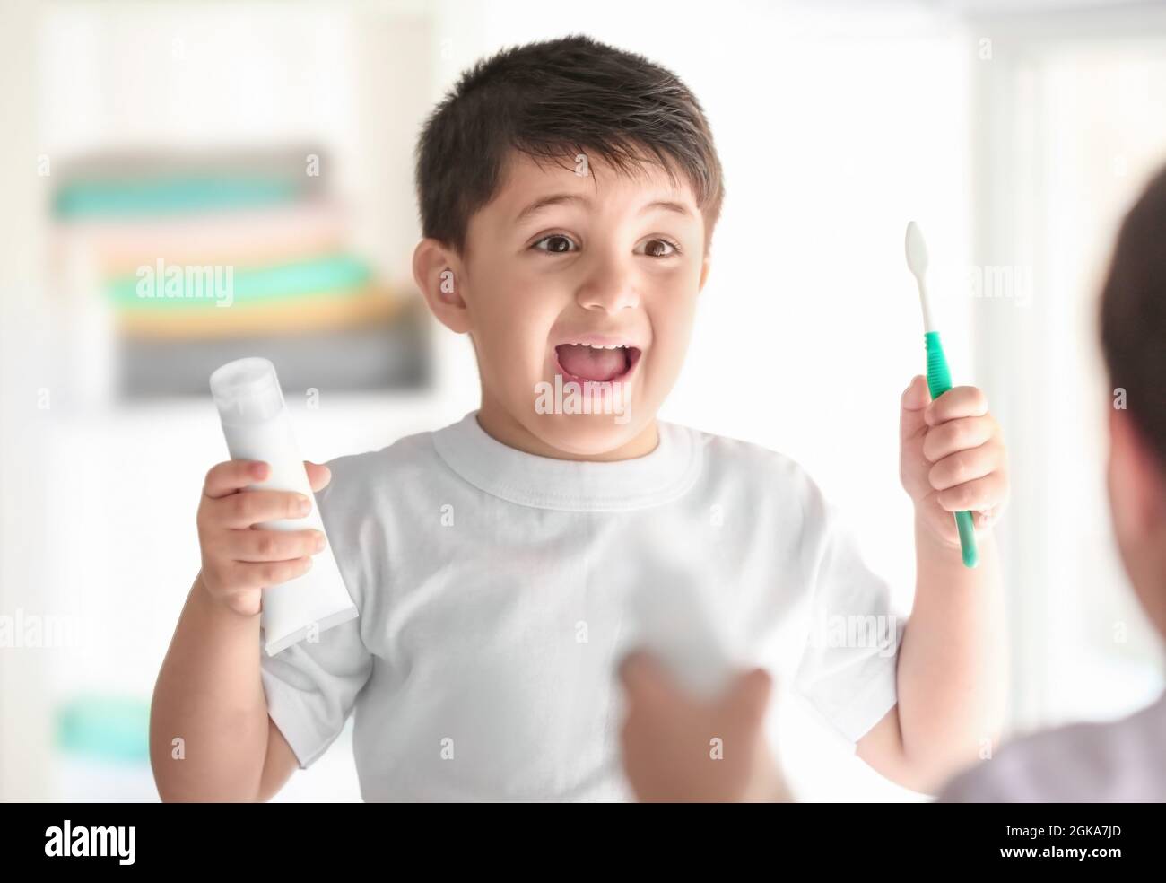Cute little boy with toothbrush and paste at home. Cleaning teeth ...
